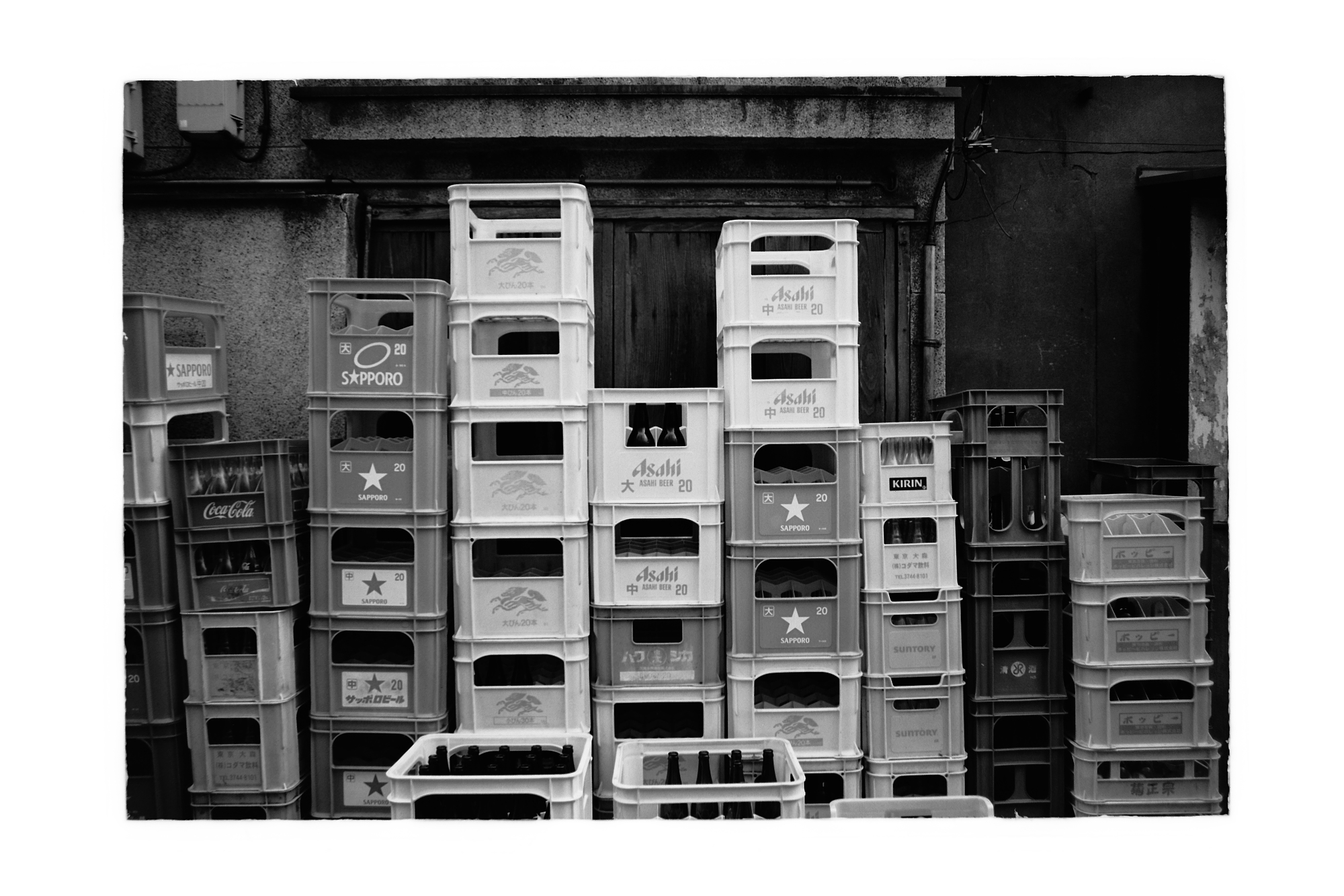 Tokyo Photography | Beer cases piled up in a narrow back alley | Black ...